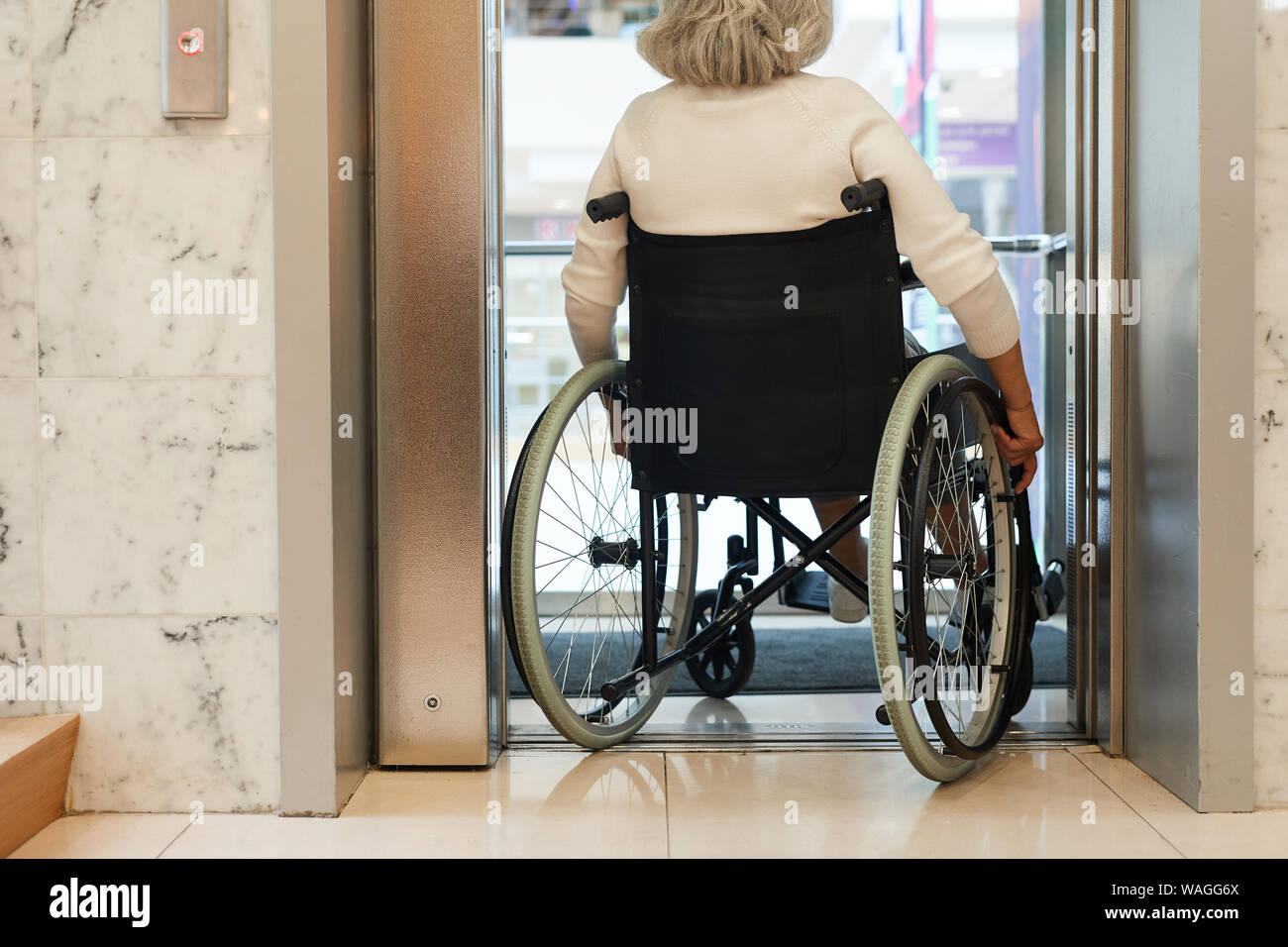 Hospital wheelchair in elevator hi-res stock photography and images - Alamy