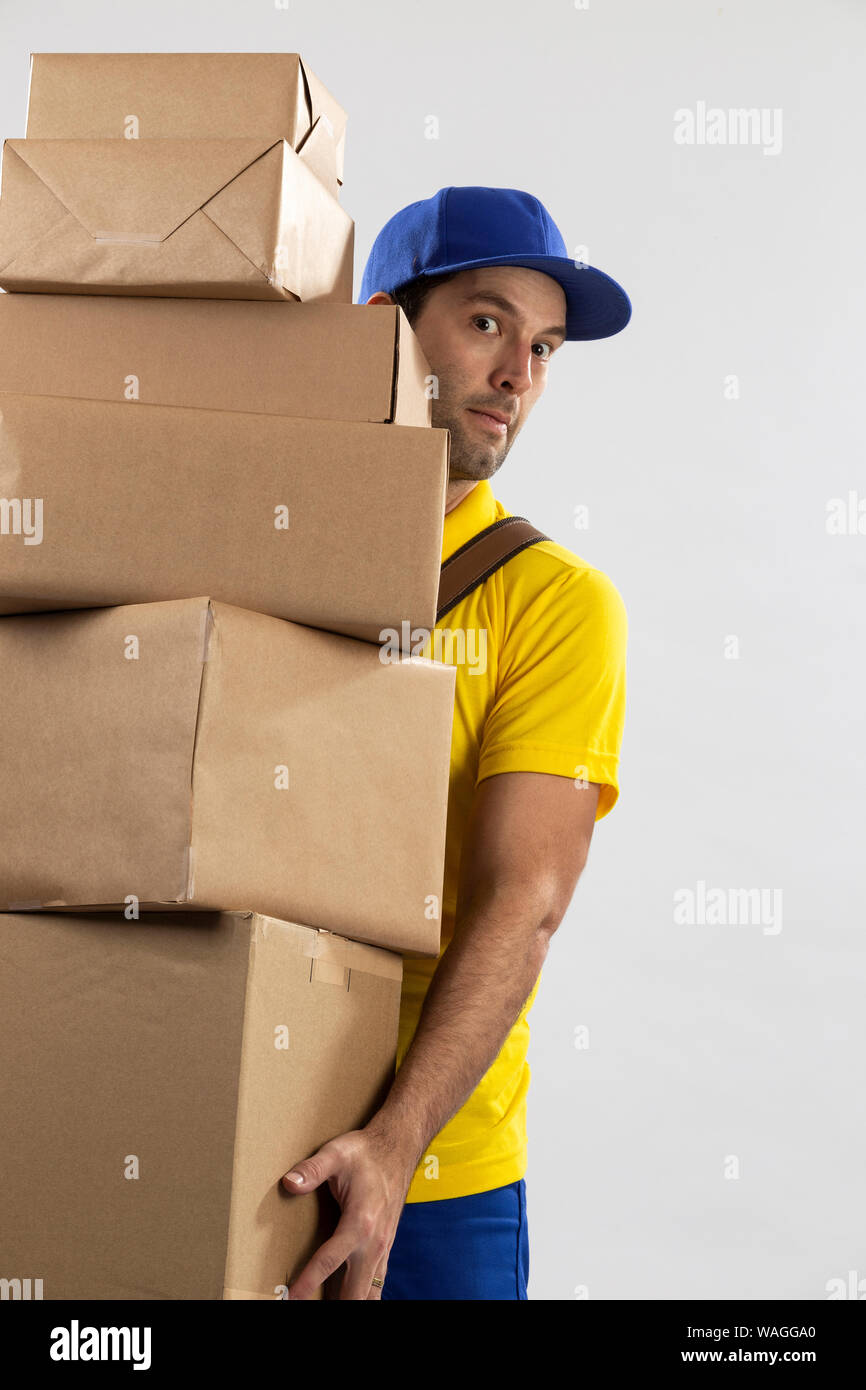 Brazilian mailman on a white background delivering a package. copy ...