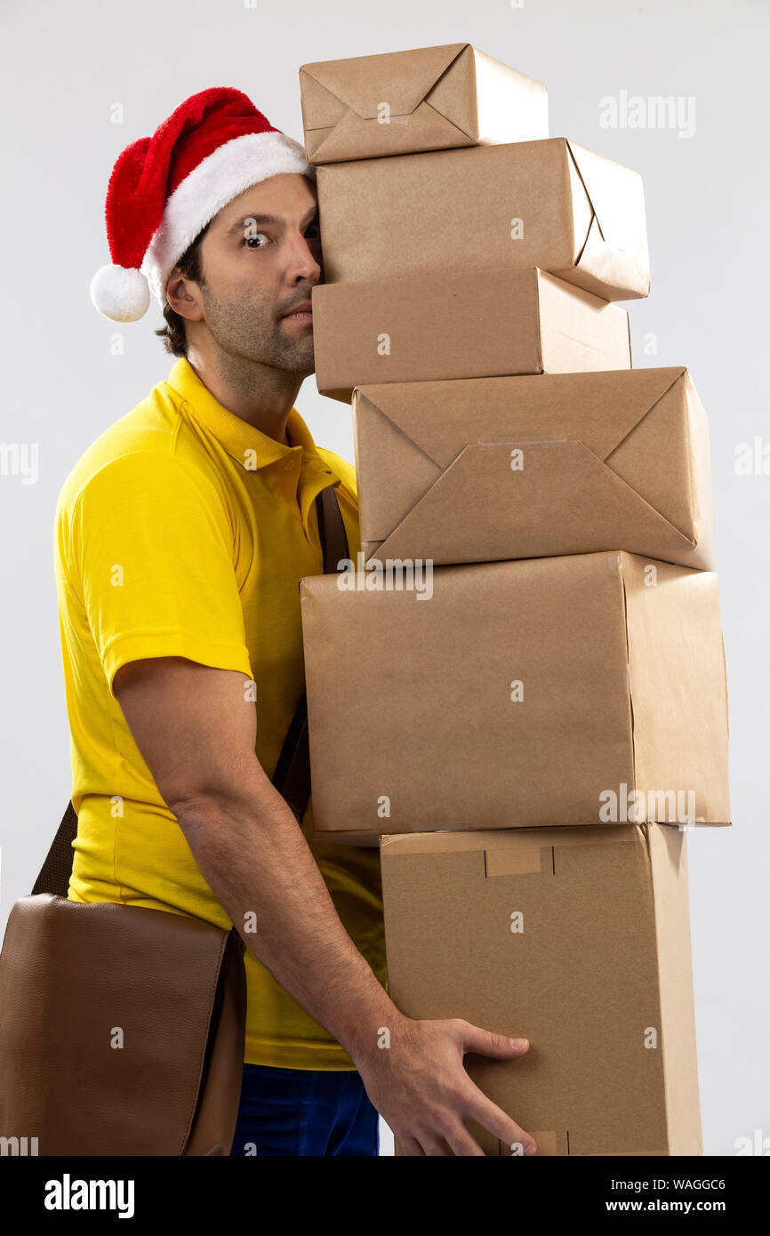 Brazilian mailman dressed as Santa Claus delivering a gift on a white ...
