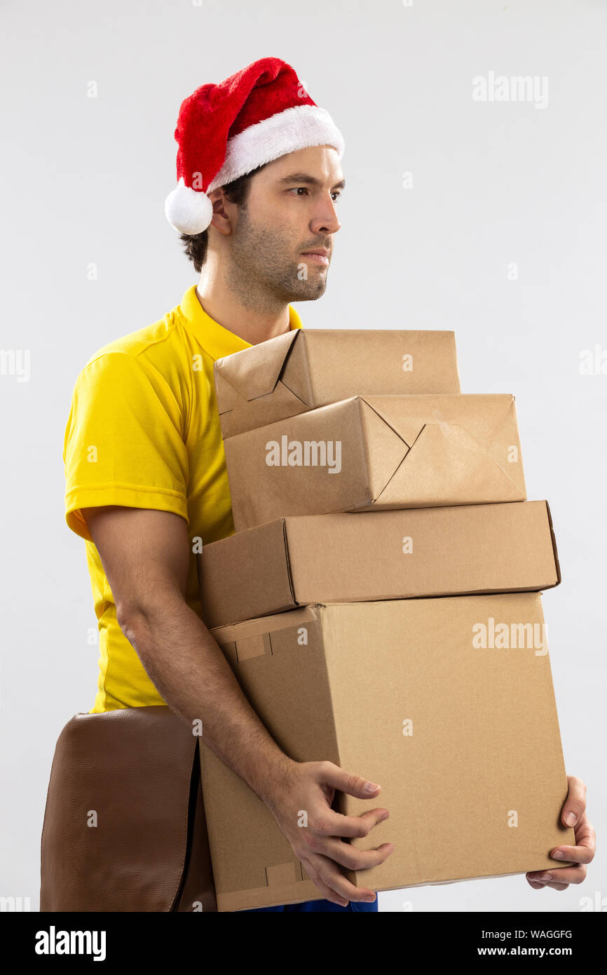 Brazilian mailman dressed as Santa Claus delivering a gift on a white ...