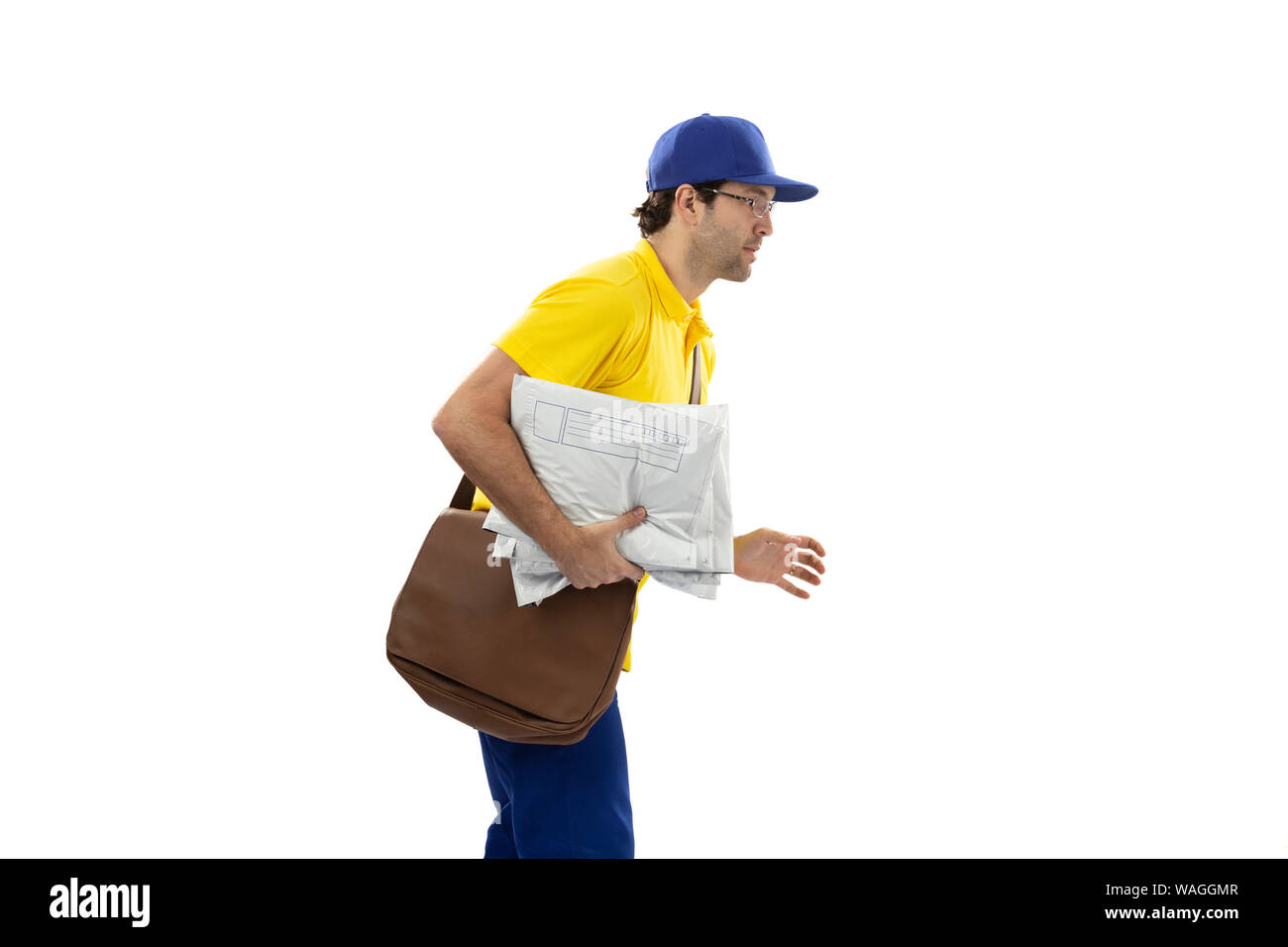 Brazilian mailman running with a package on a white background. copy ...