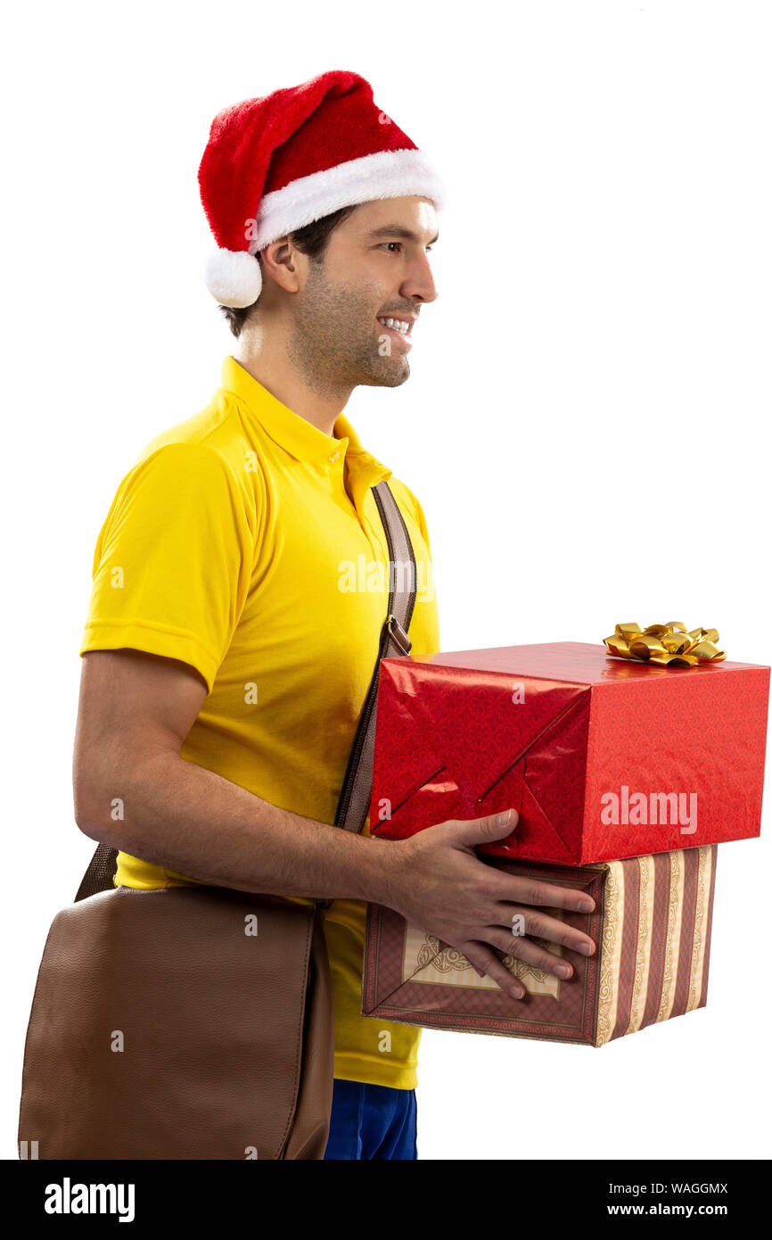 Brazilian mailman dressed as Santa Claus delivering a gift on a white ...