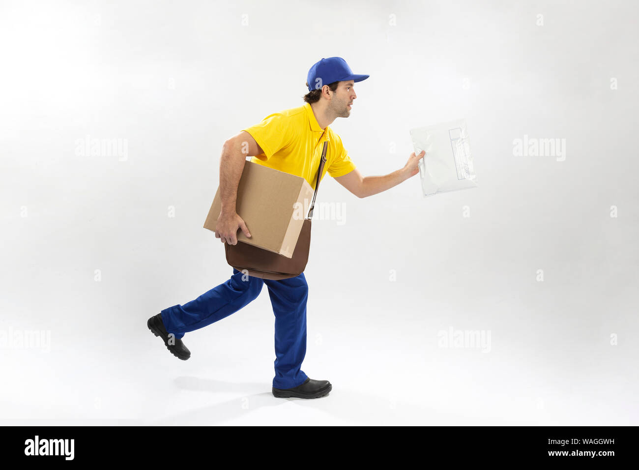 Brazilian mailman running with a package on a white background. copy ...