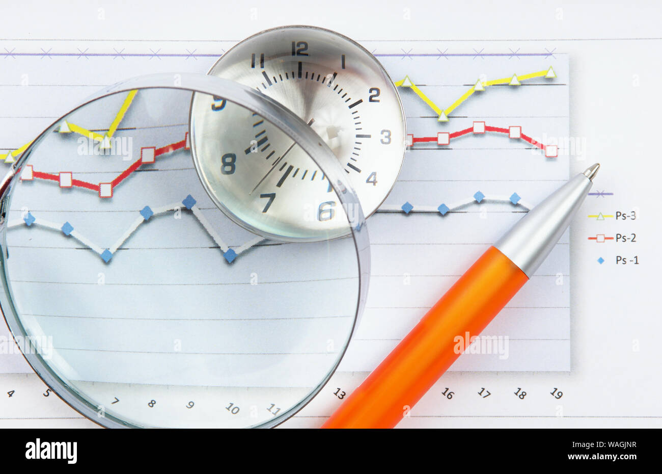 magnifying glass and watch with a diagram Stock Photo - Alamy