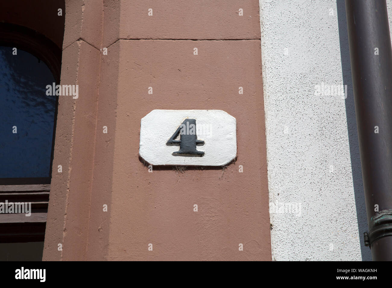 Number Four on Stone Wall Stock Photo - Alamy