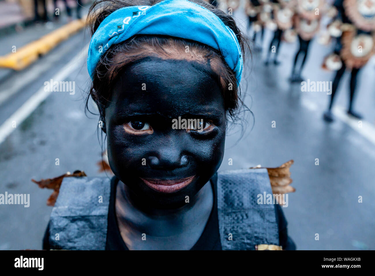 A Filipino Child Takes Part In A Children’s Parade During The Ati ...