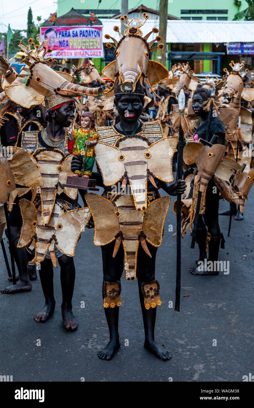 People Dressed In Tribal Costume Parade Through The Streets Of Kalibo ...