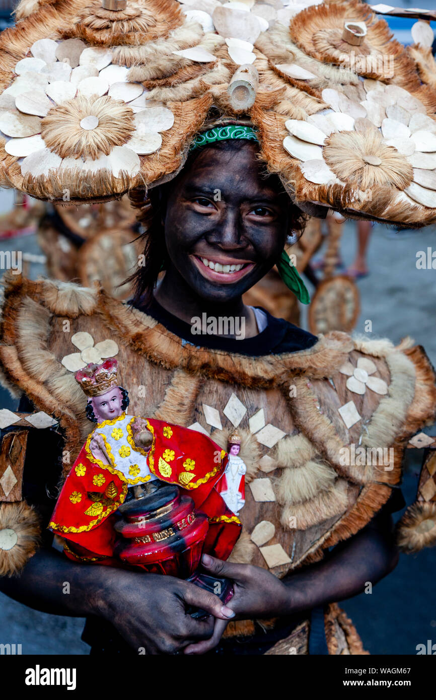 People Dressed In Tribal Costume Parade Through The Streets Of Kalibo ...