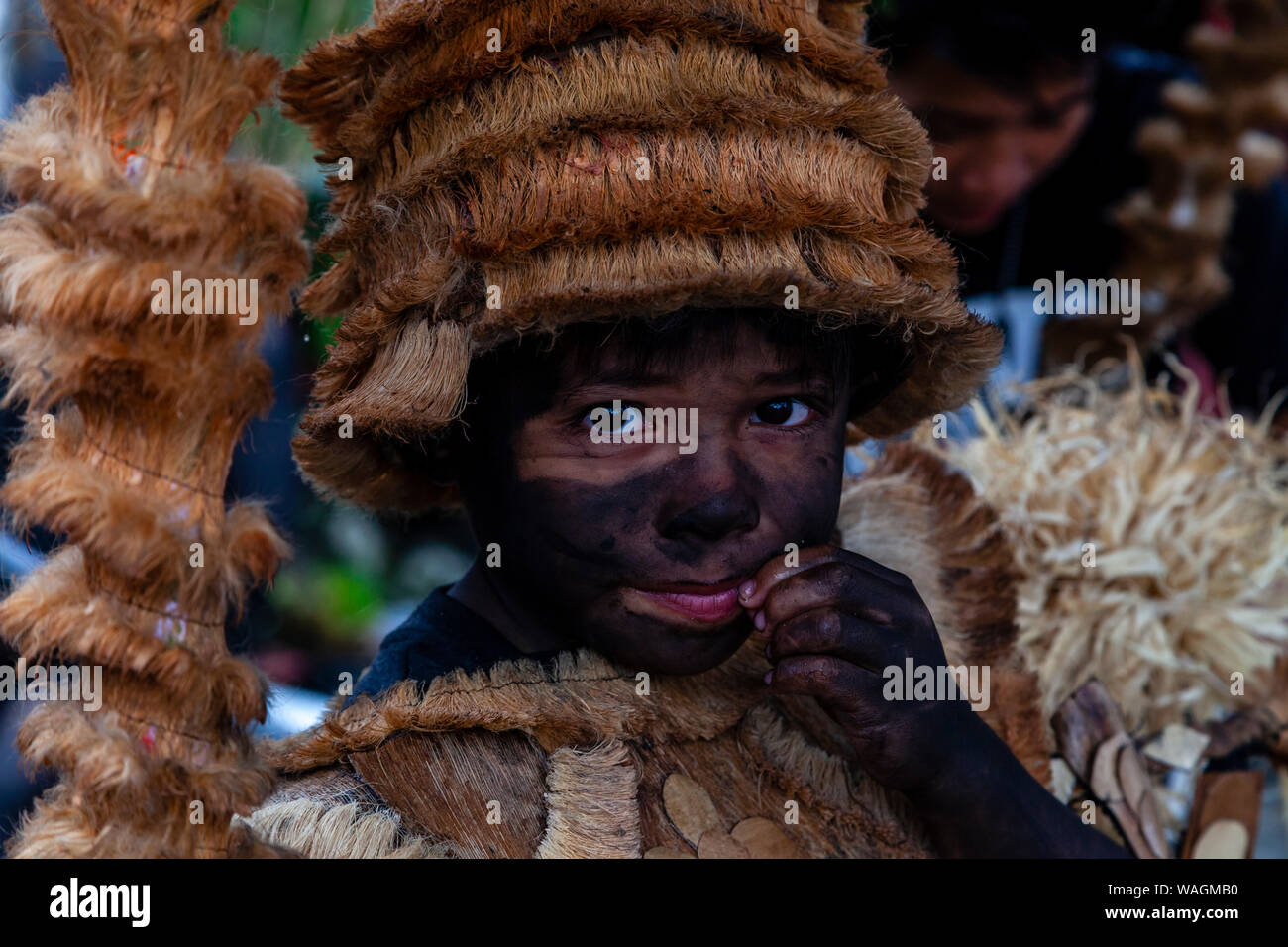 A Young Boy Dressed In Tribal Costume At The Ati-Atihan Festival ...