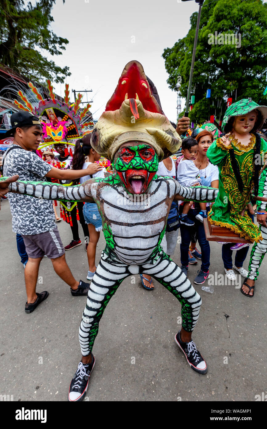People In Colourful Costumes Holding Santo Nino Statues Parade Through ...