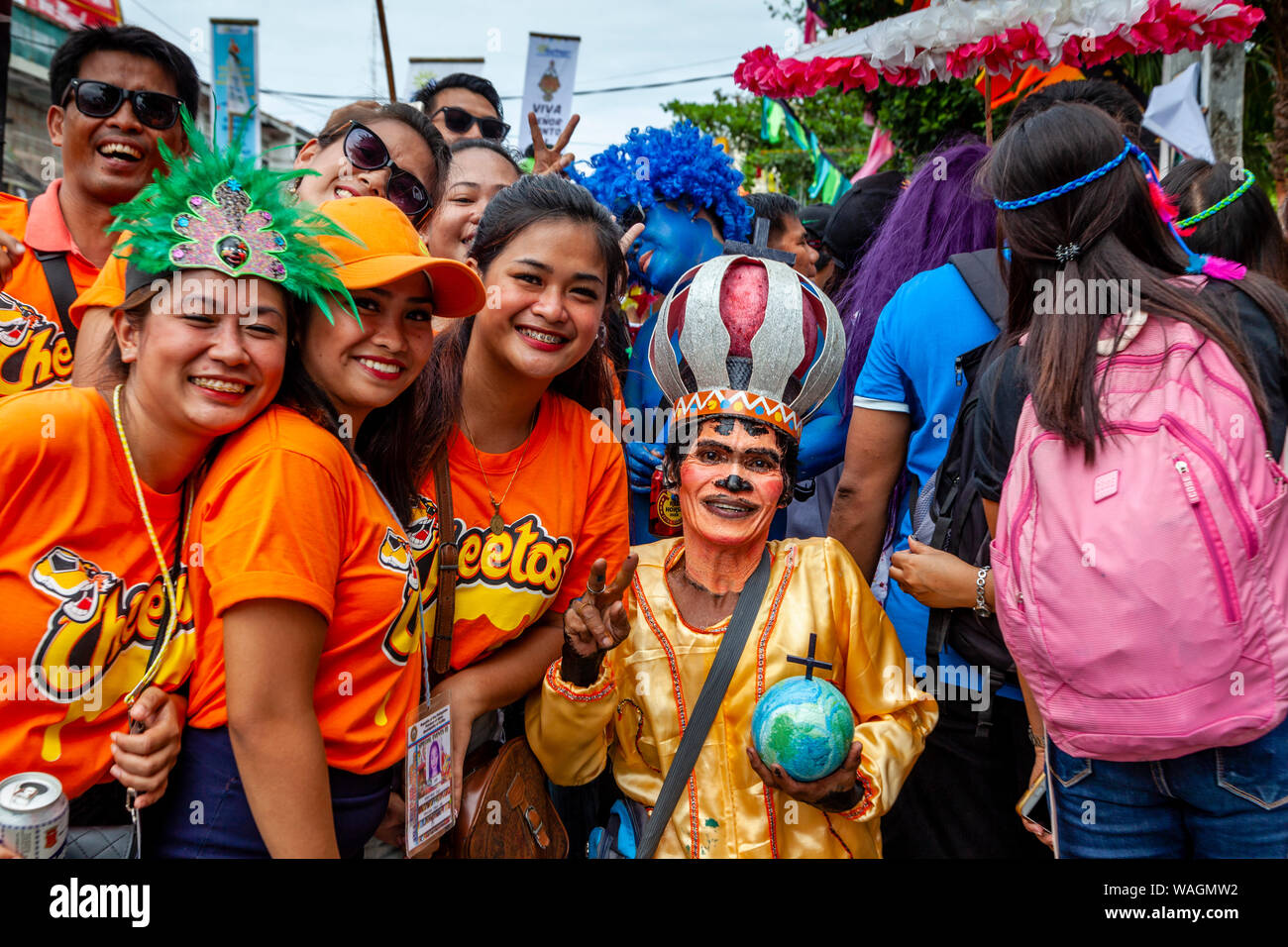 Local People In Colourful Costumes Parade Through The Streets Of Kalibo ...