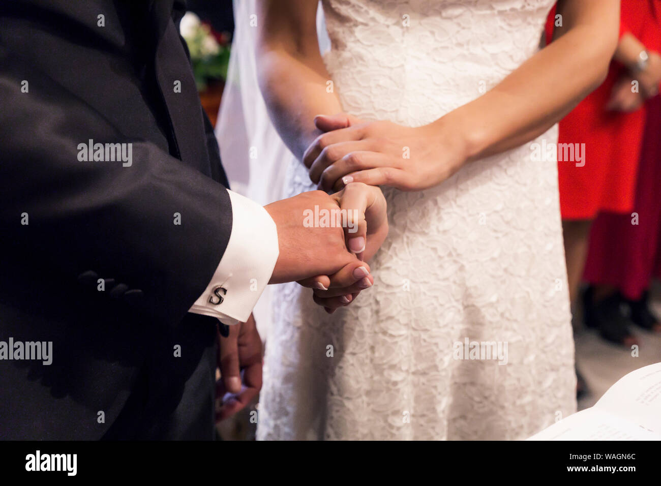 holding hands during the wedding ceremony Stock Photo - Alamy