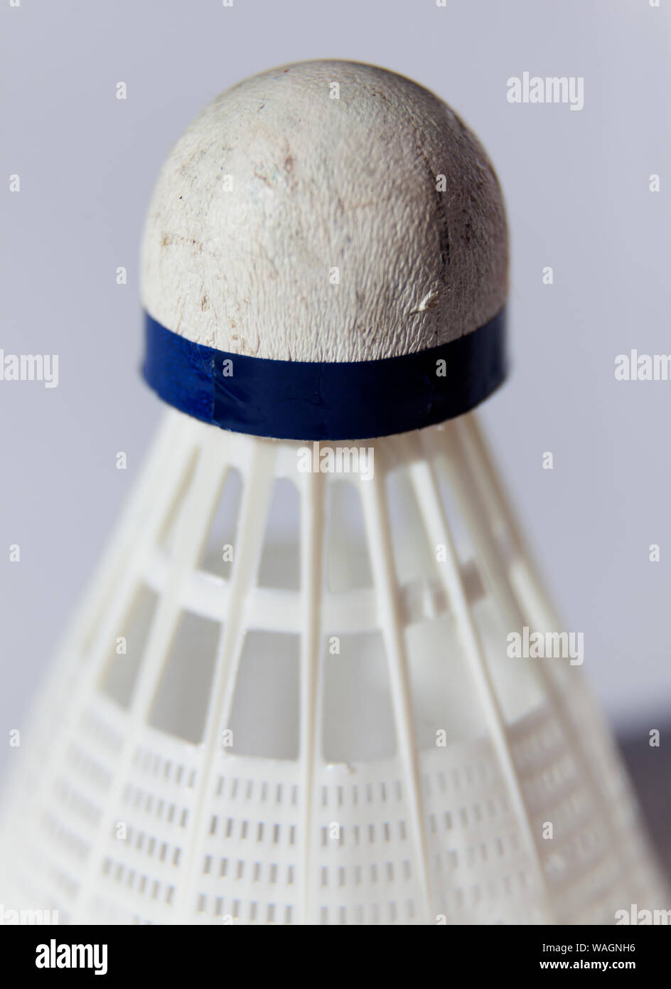 close up of a badminton ball with feathers on white background in ...