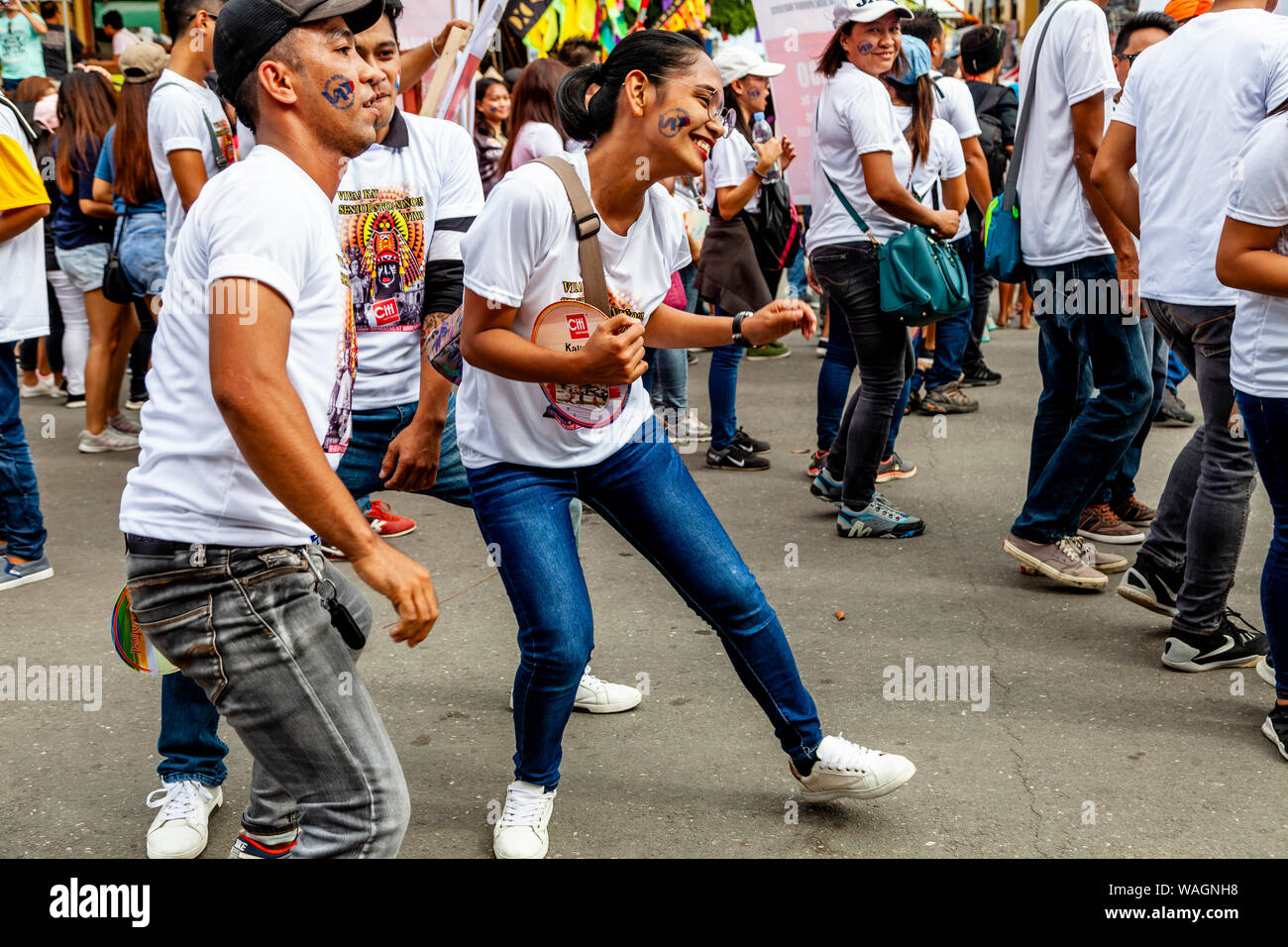 Young Filipinos Dancing In The Street During The Ati-Atihan Festival ...
