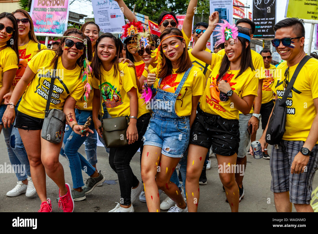 Happy Young Filipinos Take Part In A Street Procession During The Ati ...