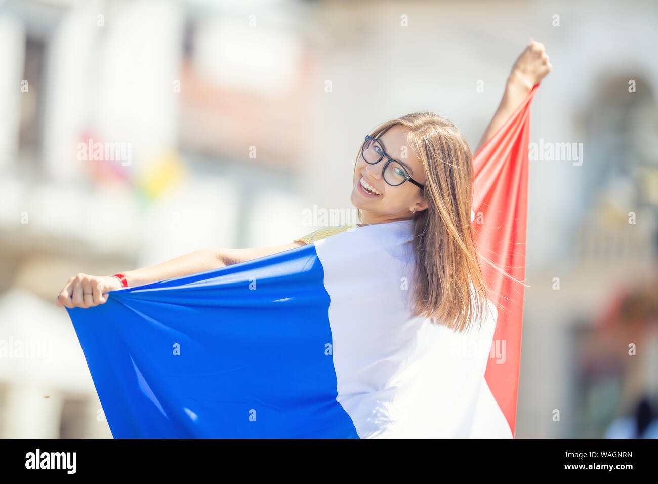 Attractive happy young girl with the France flag Stock Photo - Alamy