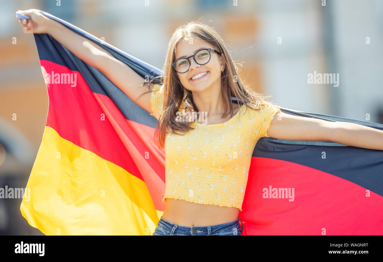 Attractive happy young girl with the germany flag Stock Photo - Alamy