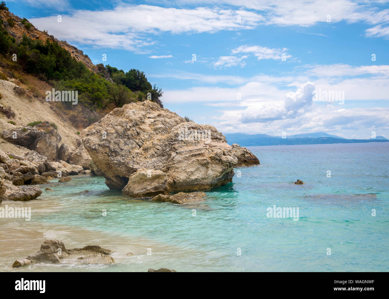 Beautiful landscape on beach in Greece. Blue sky and white clouds on a ...