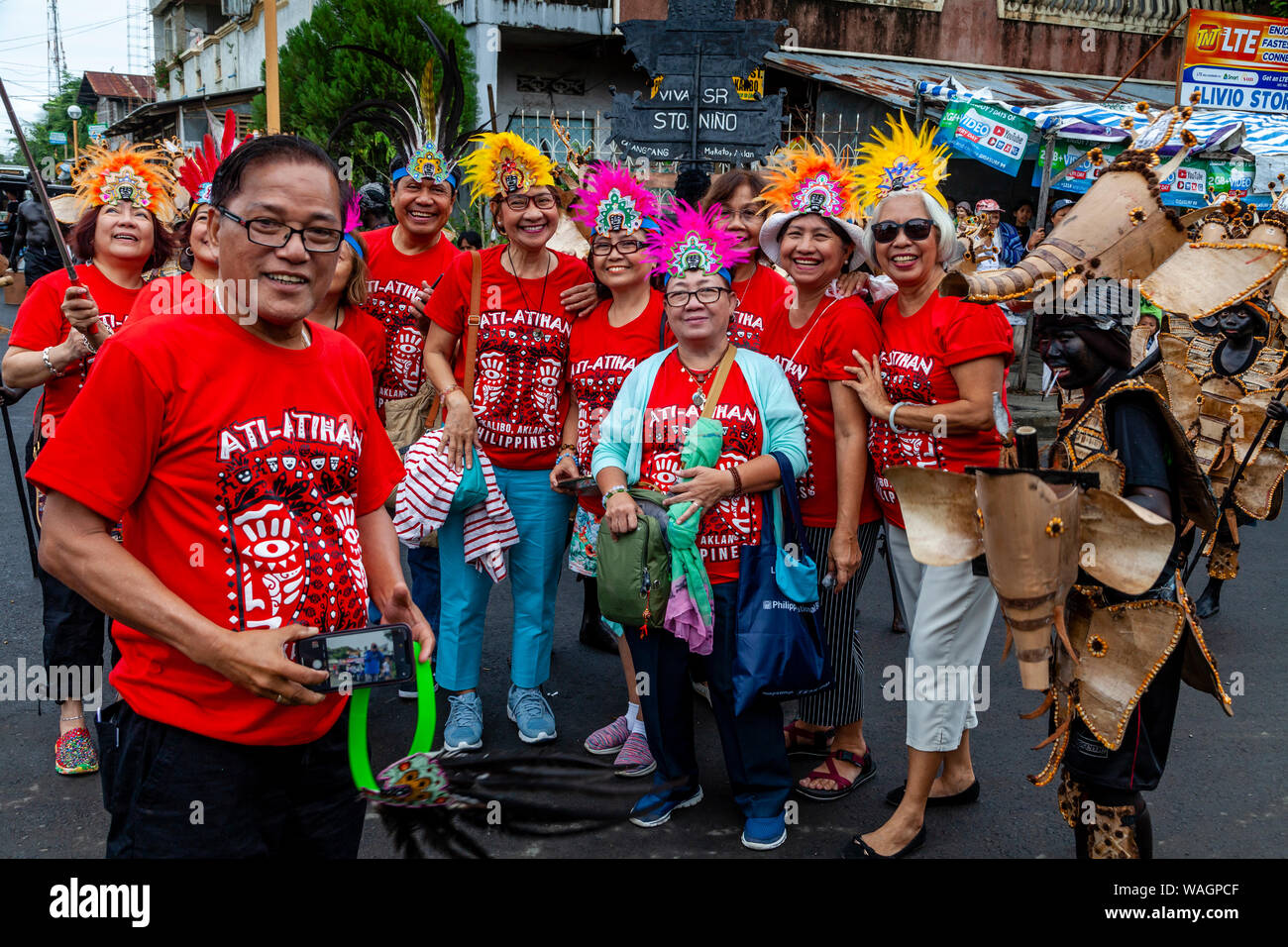 A Group Of Filipino Tourists Pose In Traditional Head Wear During The ...