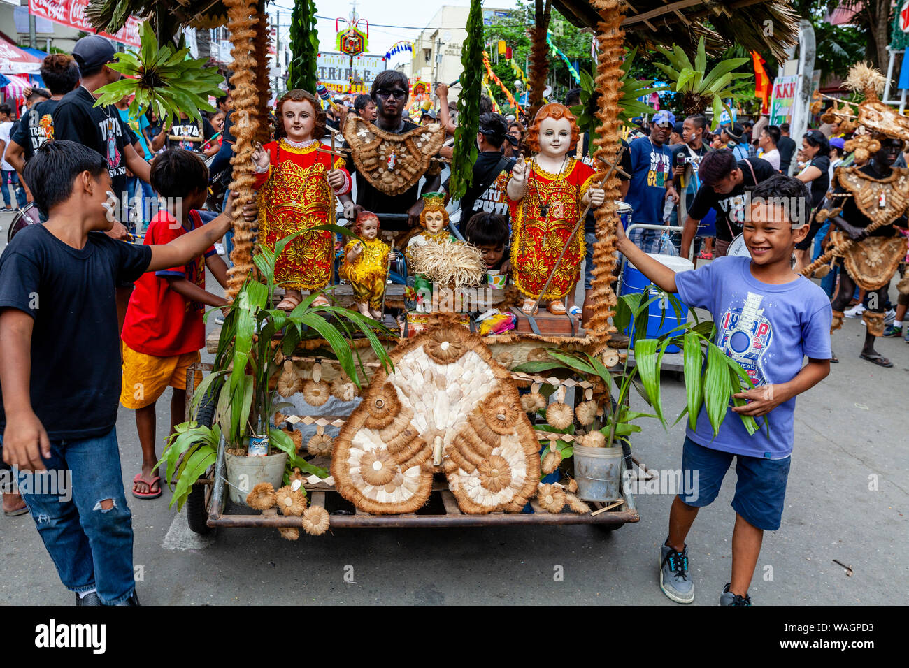 A Procession Of Floats With Santo Nino Statues Take Part In A Street ...