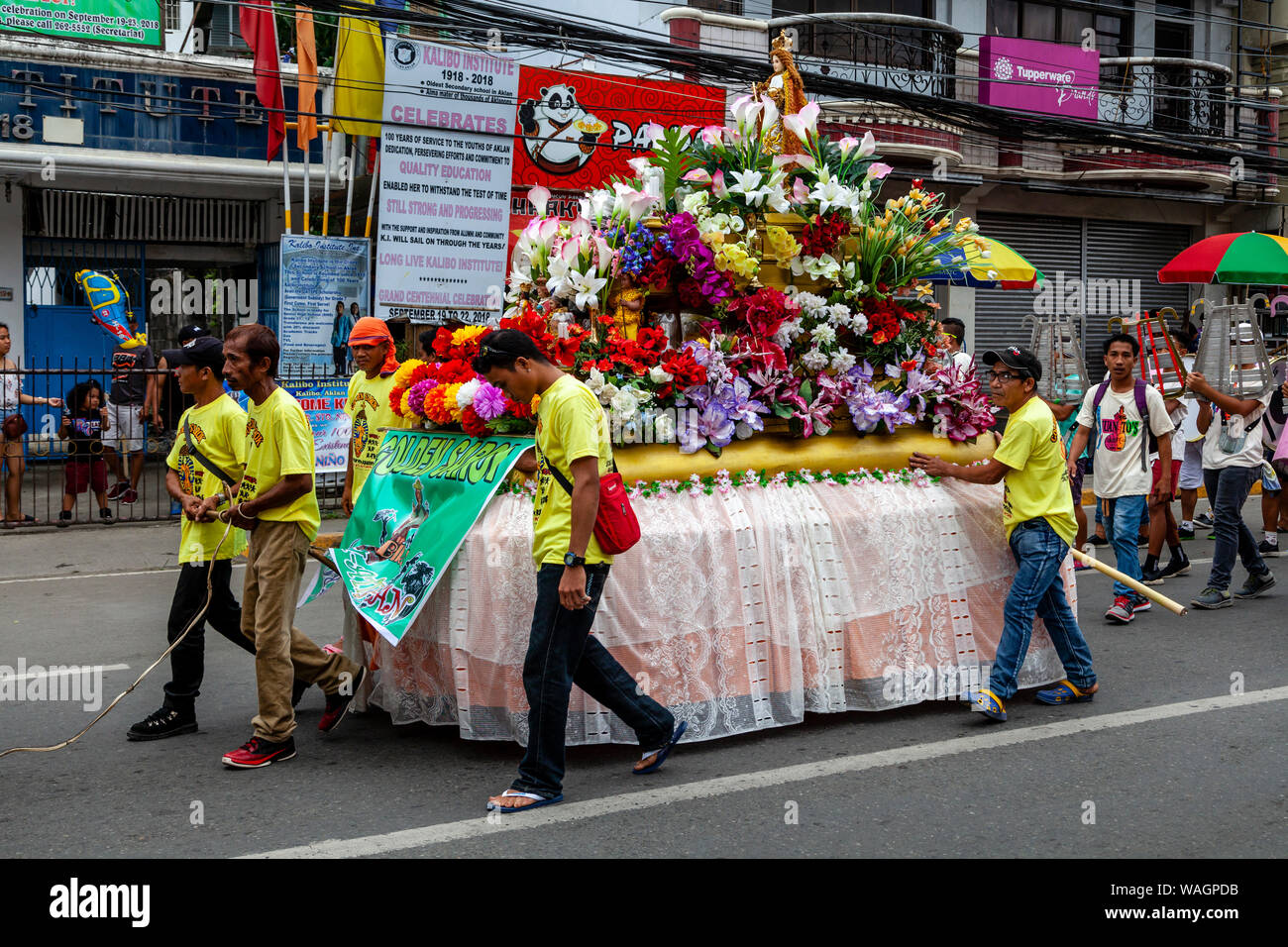 A Procession Of Floats With Santo Nino Statues Take Part In A Street ...