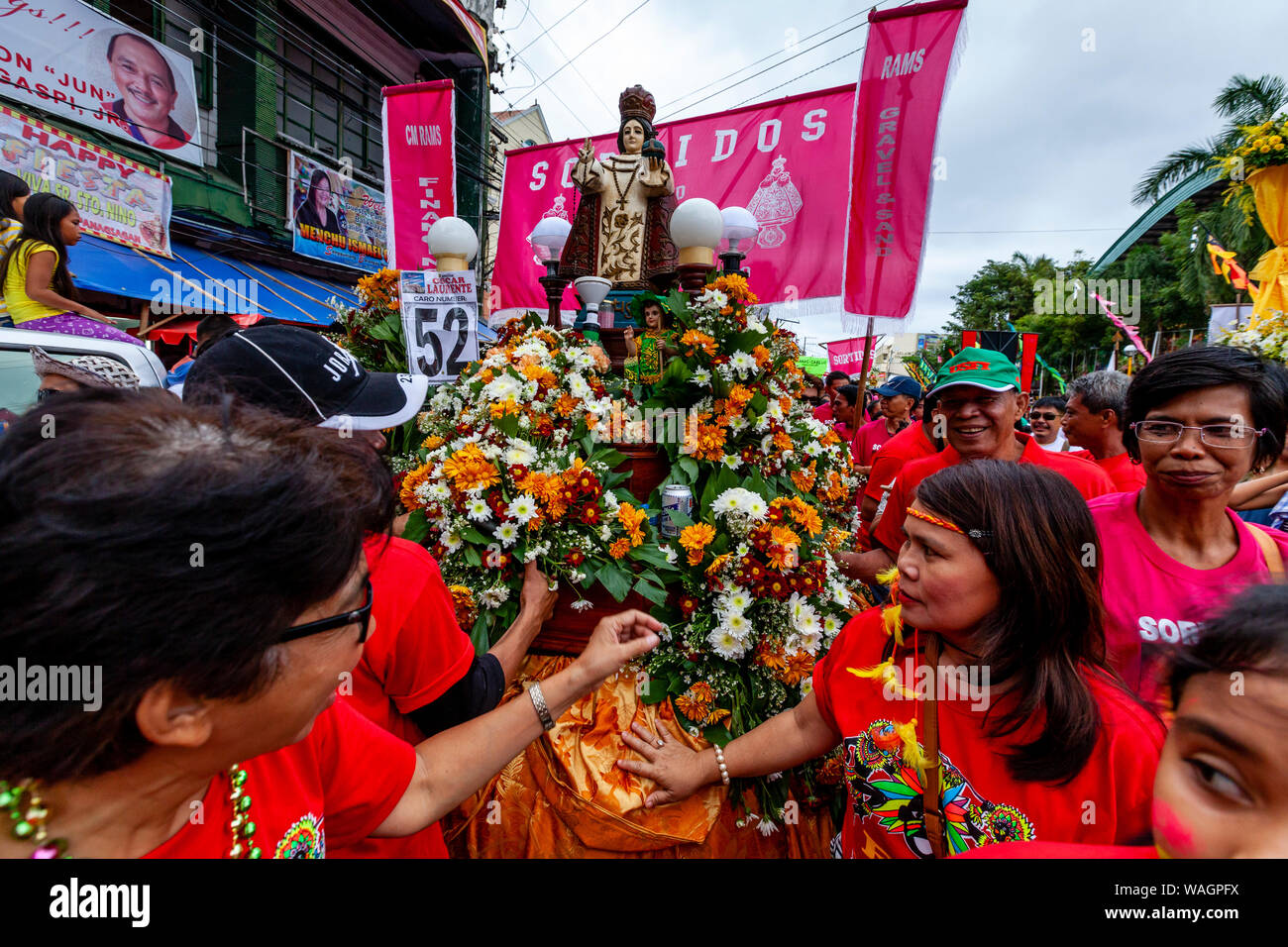 A Procession Of Floats With Santo Nino Statues Take Part In A Street ...