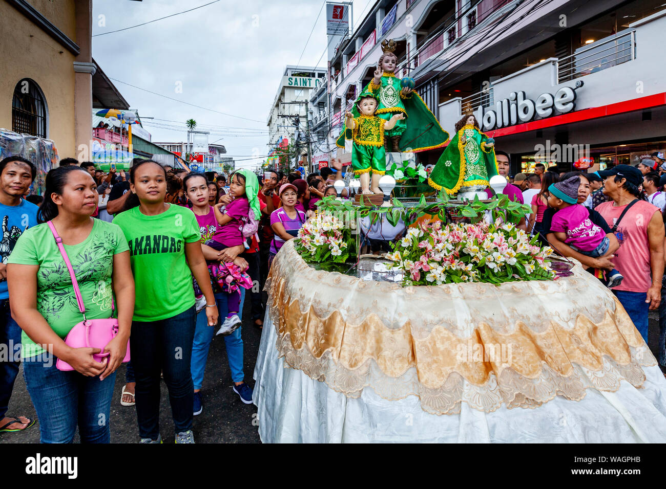 A Procession Of Floats With Santo Nino Statues Take Part In A Street ...