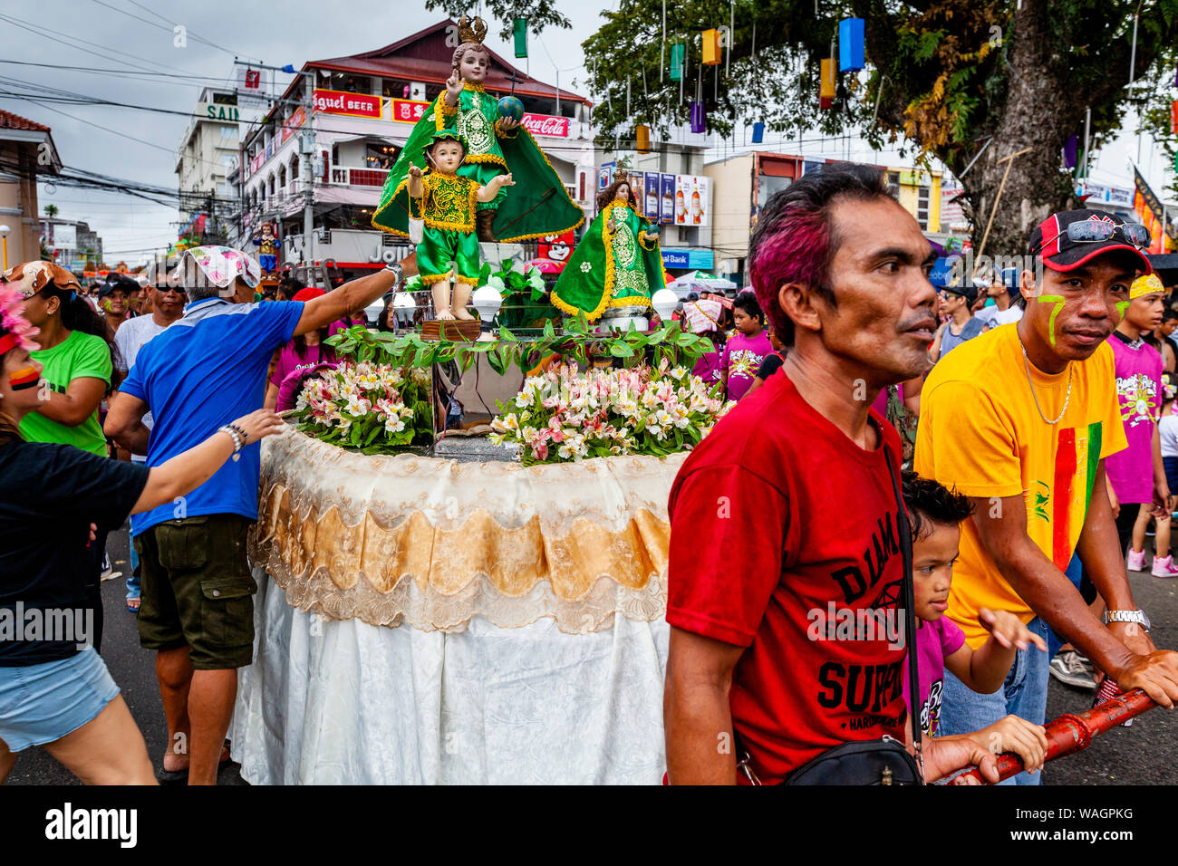 A Procession Of Floats With Santo Nino Statues Take Part In A Street ...