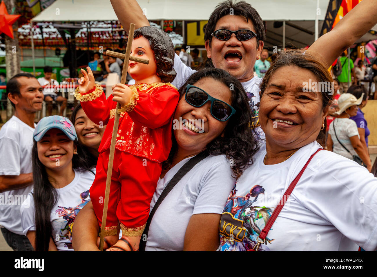 Local People Parade Their Santo Nino Statues Around The Streets Of ...