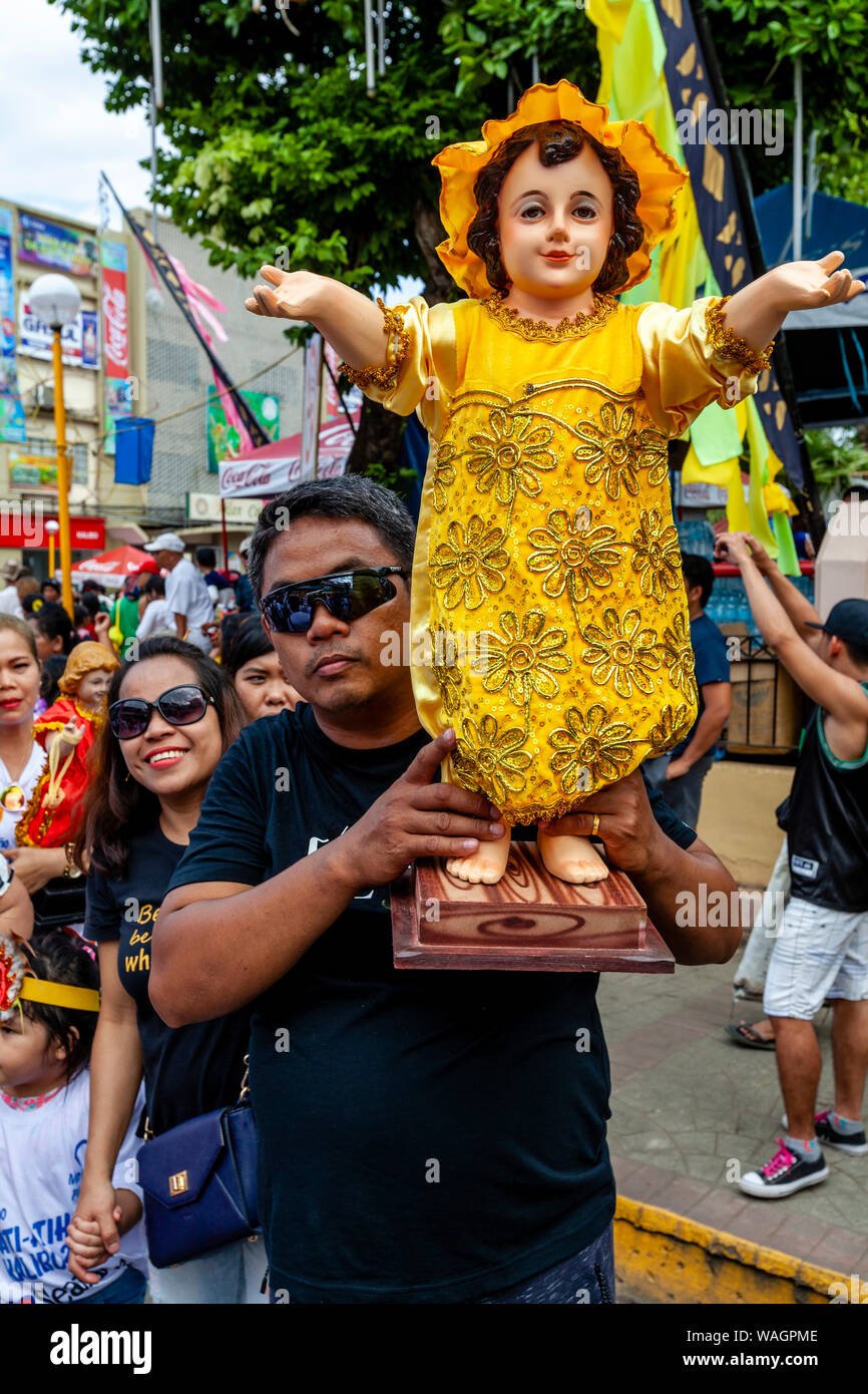 Local People Parade Their Santo Nino Statues Around The Streets Of ...