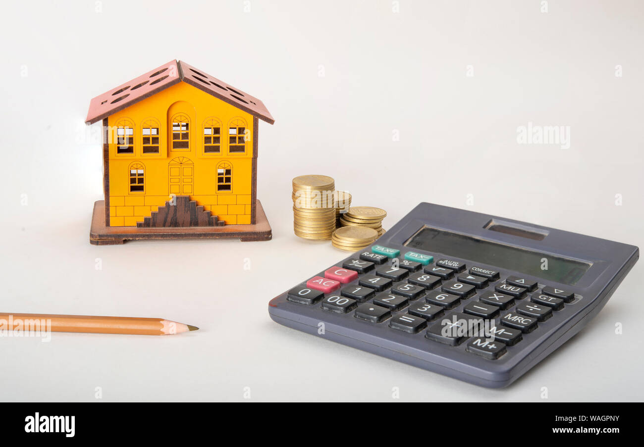 Planning to build your dream home with calculator and home miniature ...