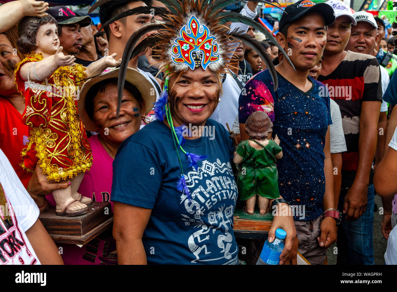 Local People Parade Their Santo Nino Statues Around The Streets Of ...