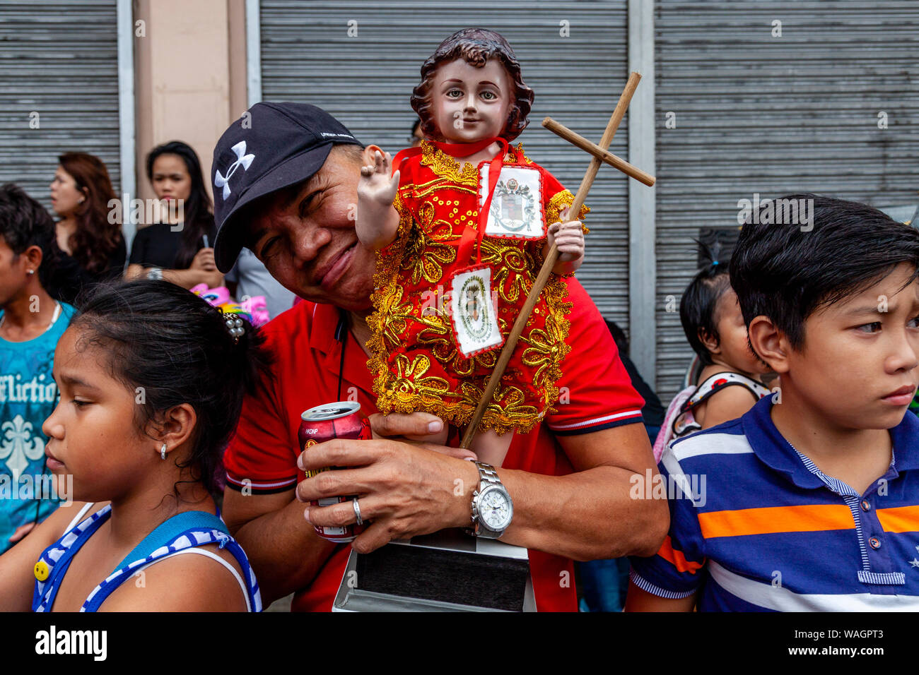 Local People Parade Their Santo Nino Statues Around The Streets Of ...