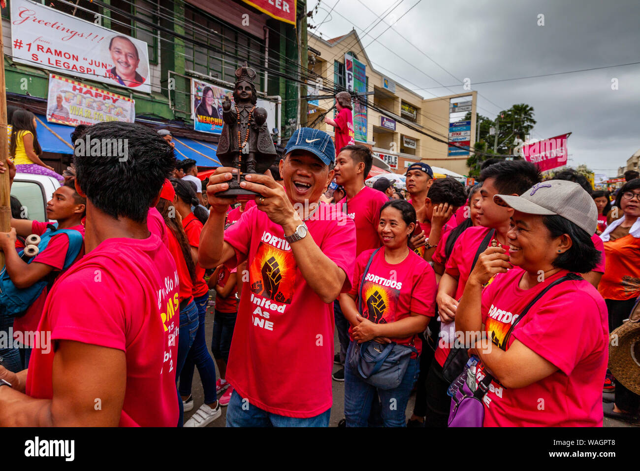 Local People Parade Their Santo Nino Statues Around The Streets Of ...