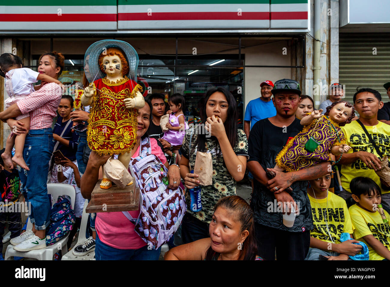 Local People Parade Their Santo Nino Statues Around The Streets Of ...