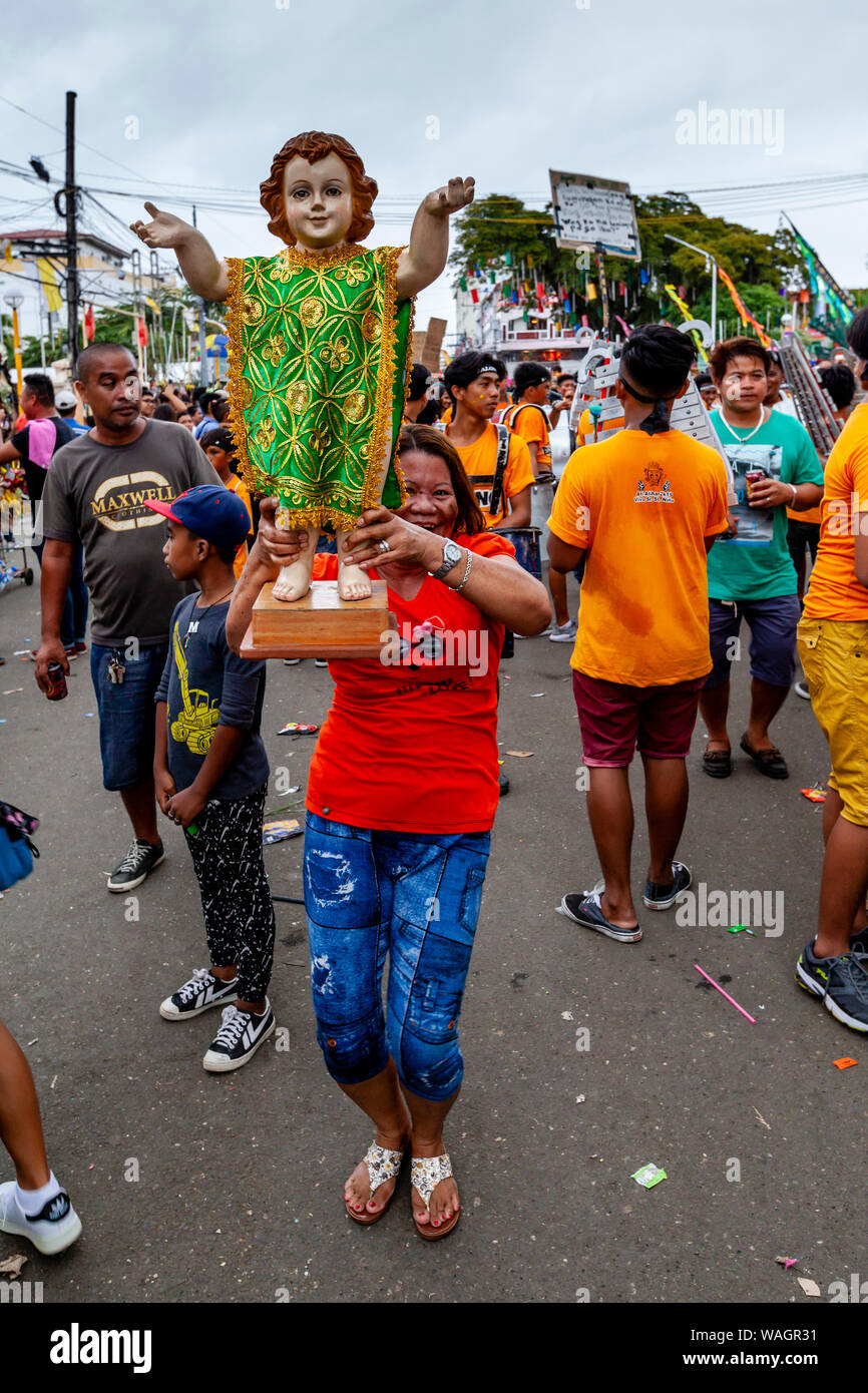 Local People Parade Their Santo Nino Statues Around The Streets Of ...