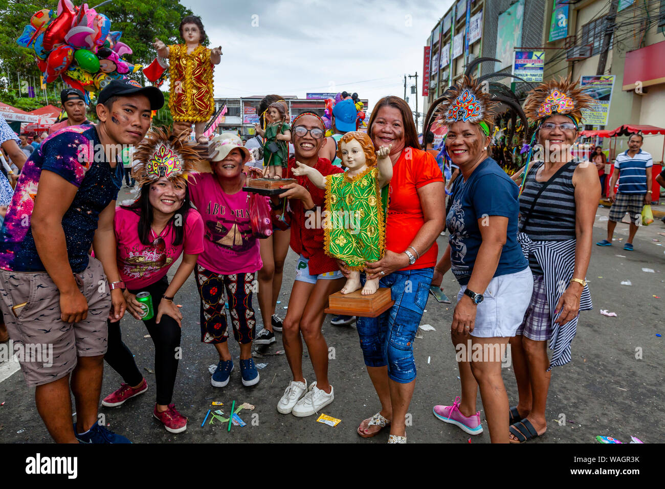 Local People Parade Their Santo Nino Statues Around The Streets Of ...