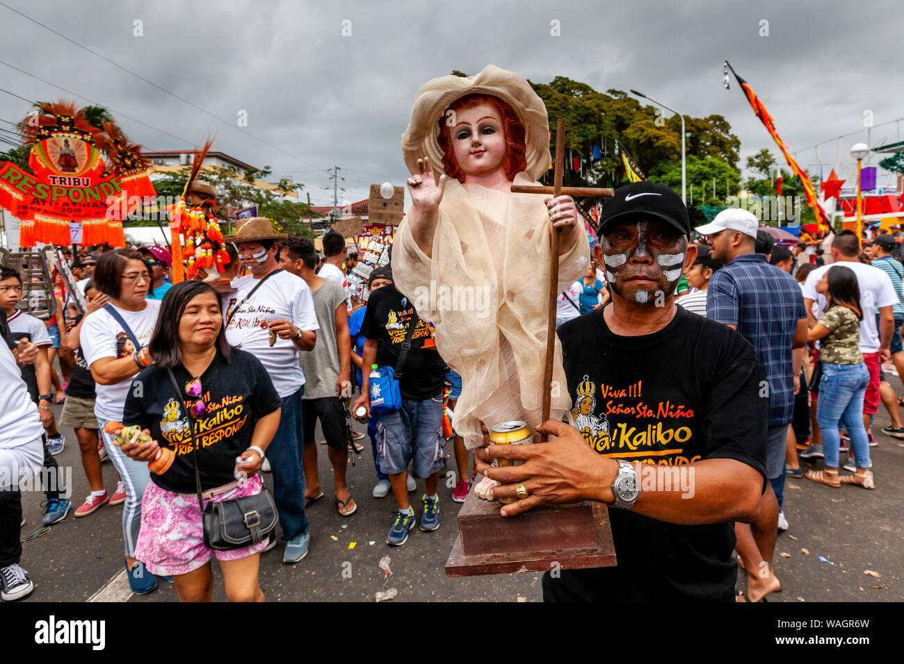 Local People Parade Their Santo Nino Statues Around The Streets Of ...
