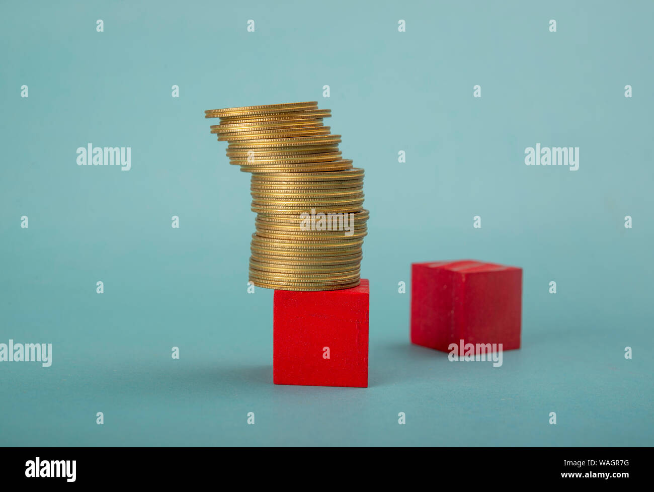 Coin Stack on red wooden block, income tax, property tax concept Stock ...