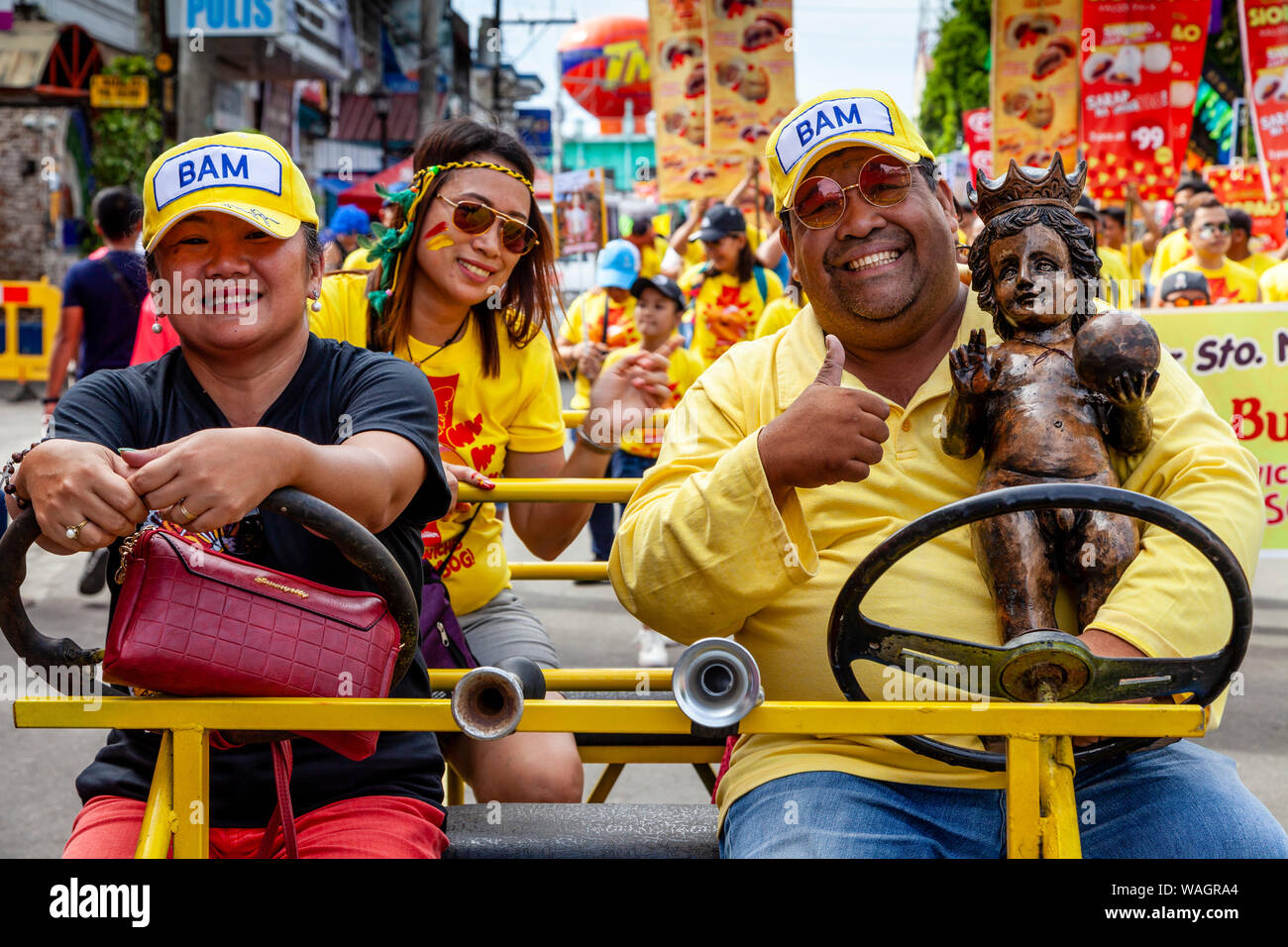 Local People Parade Their Santo Nino Statues Around The Streets Of ...