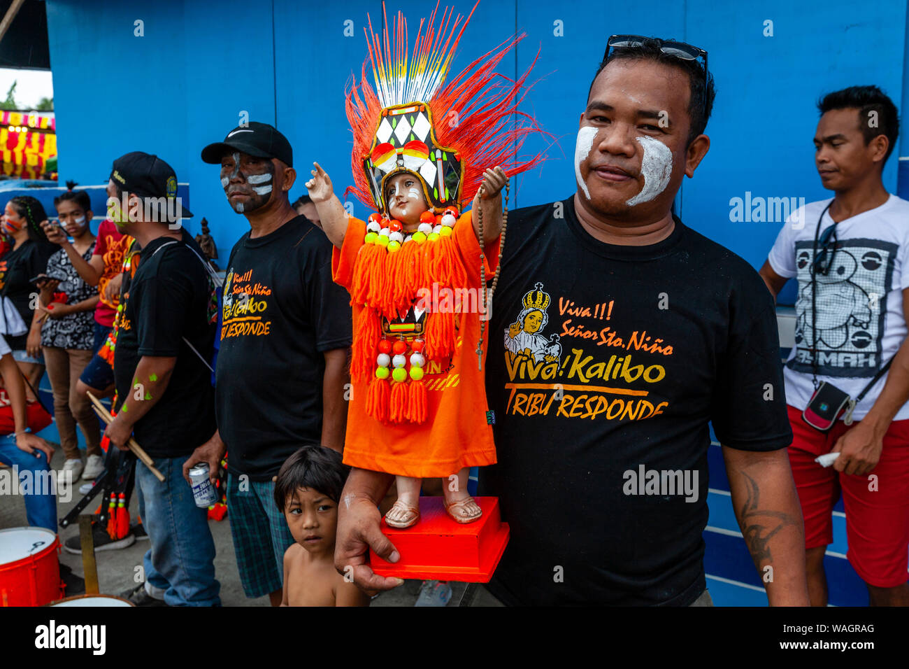 Local People Wait With Their Santo Nino Statues For The Procession To ...