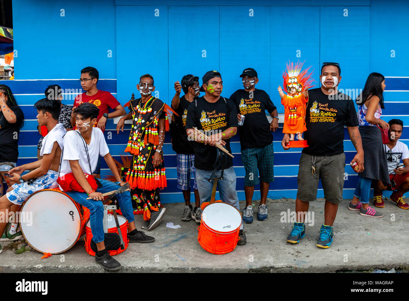 Local People Wait With Their Santo Nino Statues For The Procession To ...