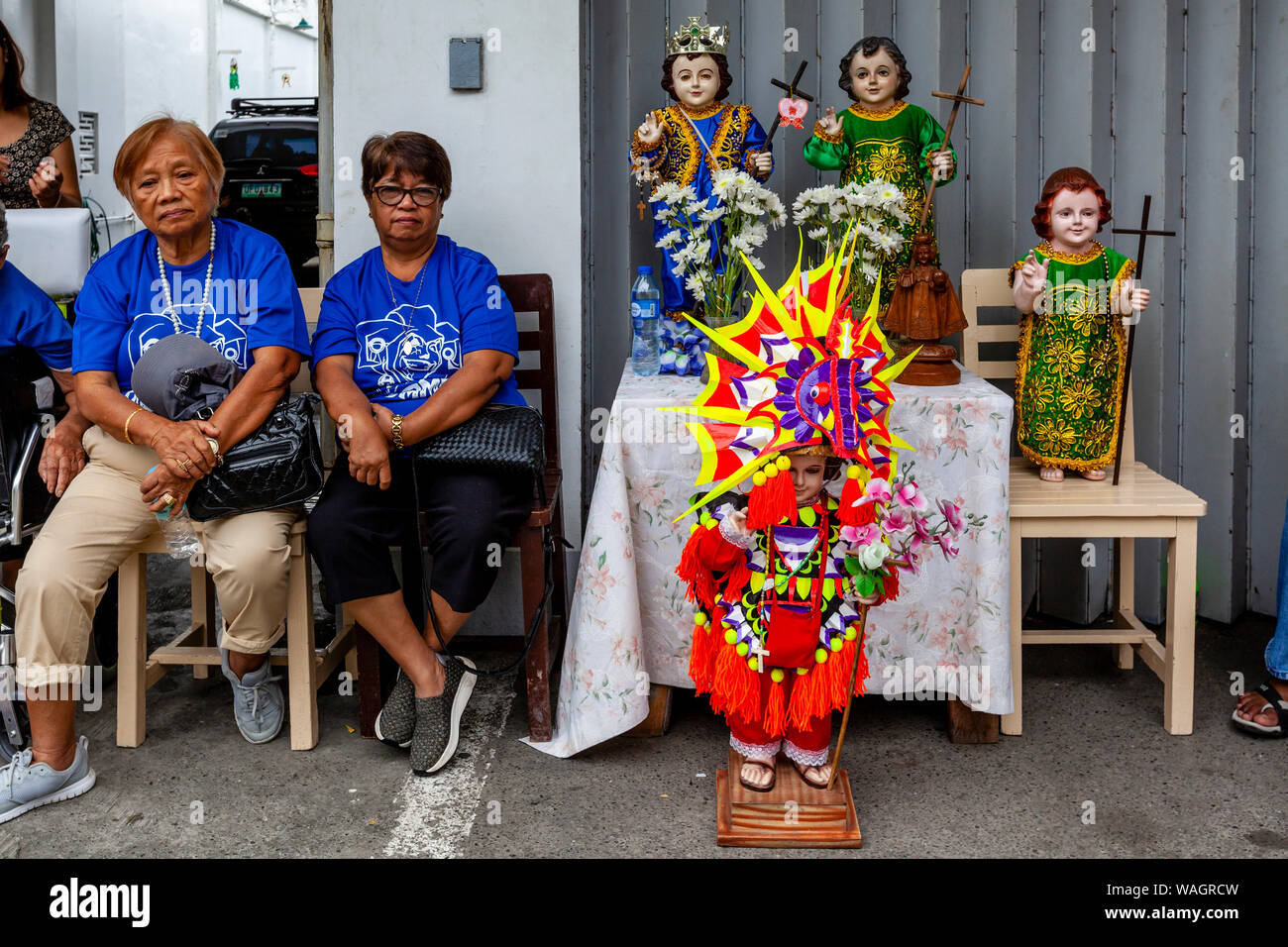 Local People Wait With Their Santo Nino Statues For The Procession To ...