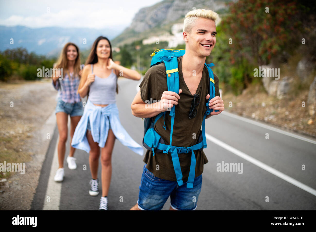 Group of friends traveling together and having fun Stock Photo - Alamy