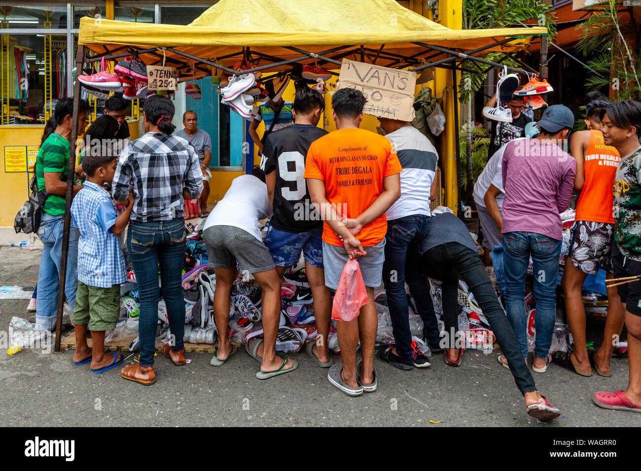 Filipino People Buying Shoes From A Market Stall In Kalibo, Panay ...