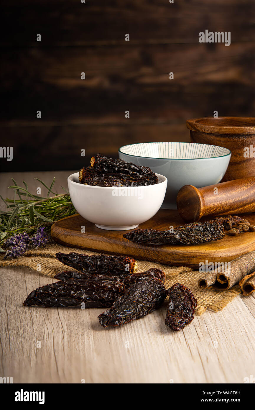 Dried Chipotle Chilli Chile Pods in a bowl and food preparation and ...