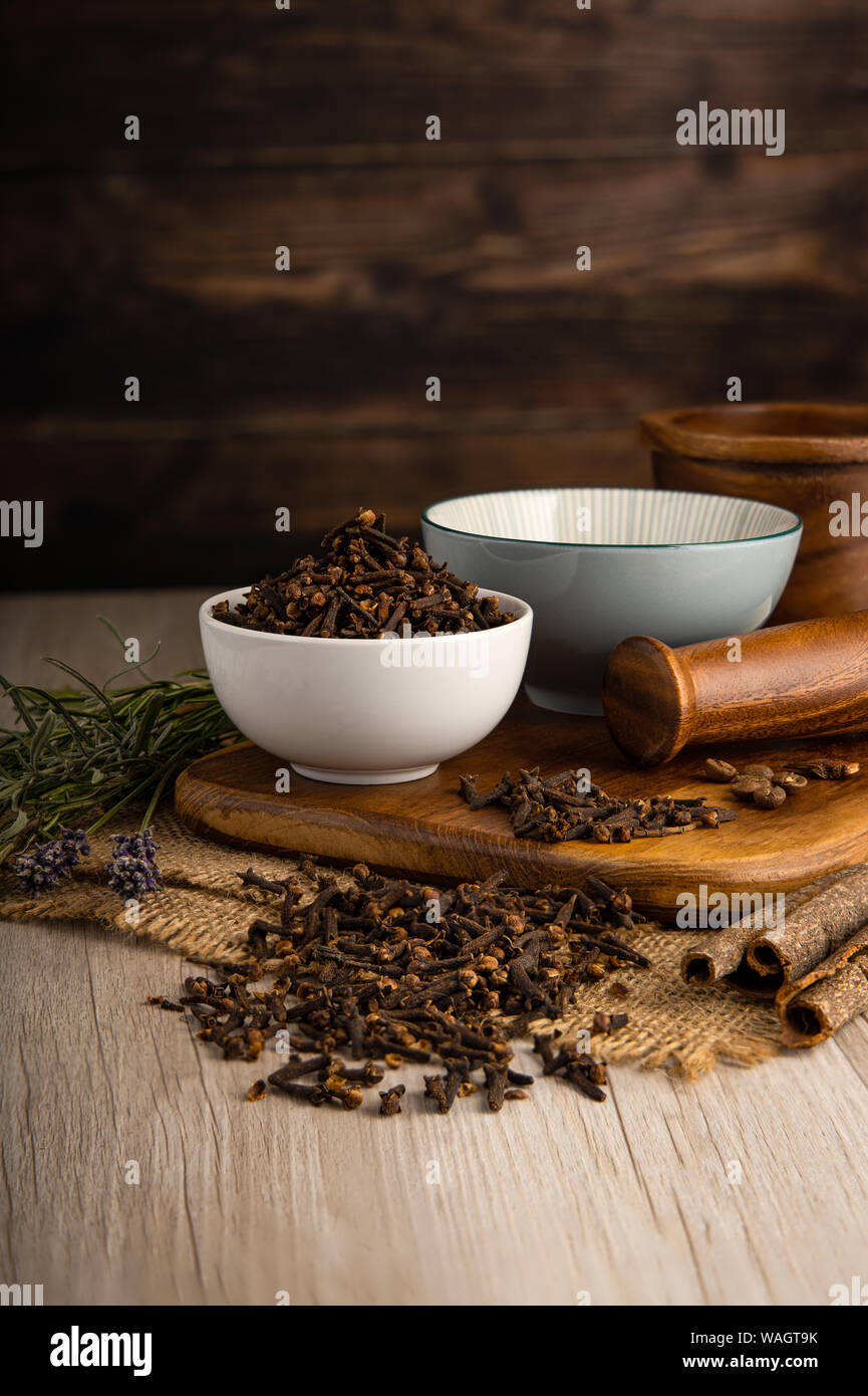 Whole Cloves in a bowl and food preparation and kitchen setting Stock ...