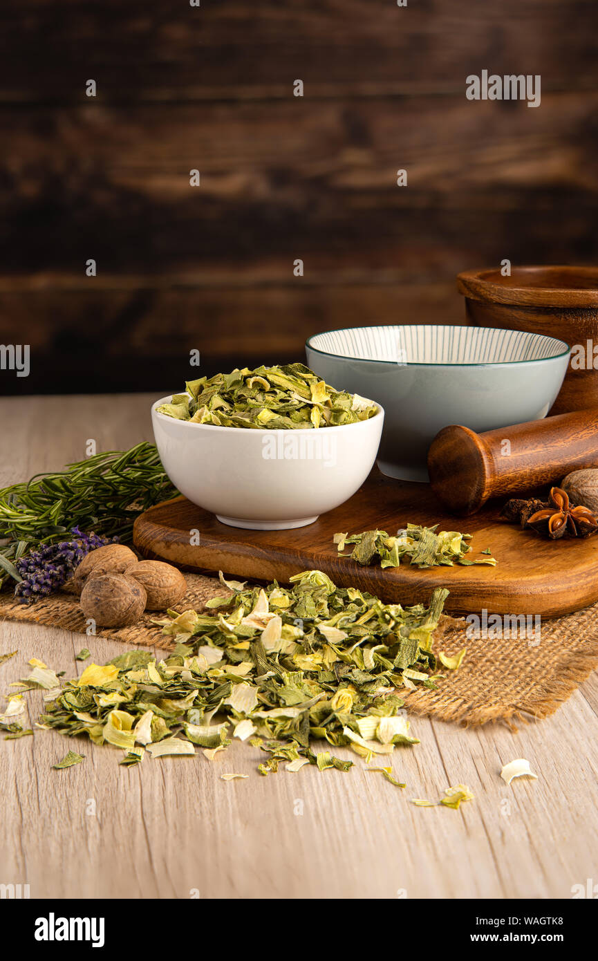 Leek Flakes in a bowl and food preparation and kitchen setting Stock ...