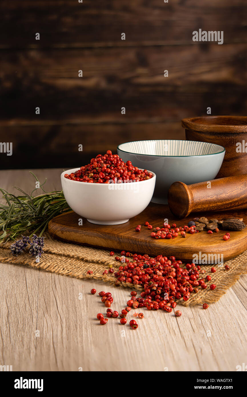 Pink Peppercorns in a bowl and food preparation and kitchen setting ...