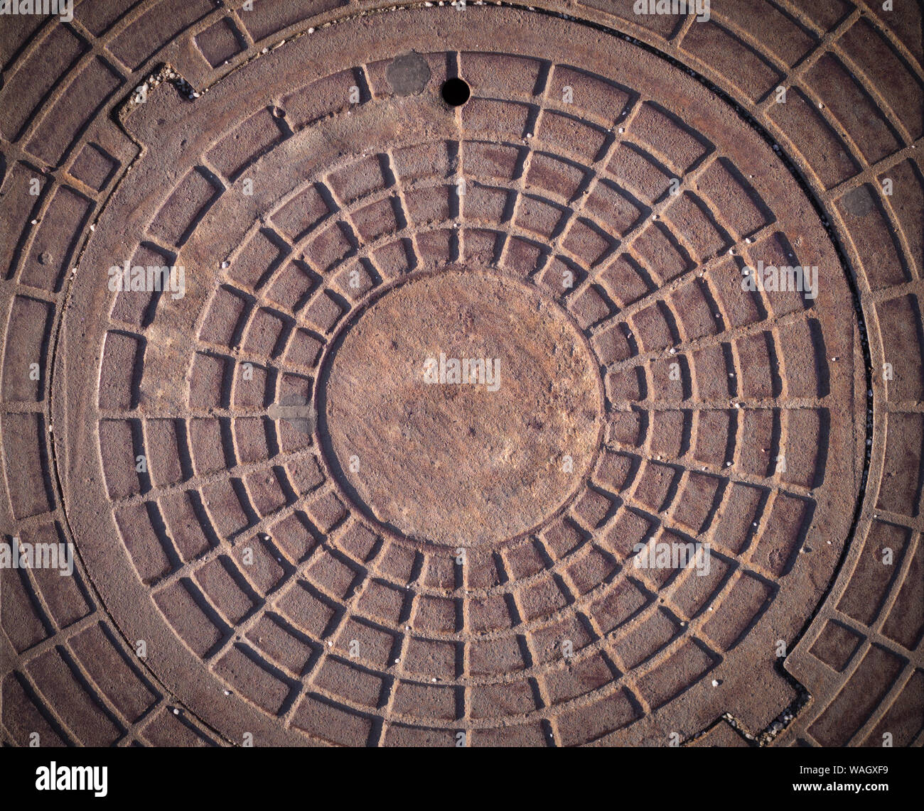 sewer metal iron hatch on the sidewalk with vignette. background ...